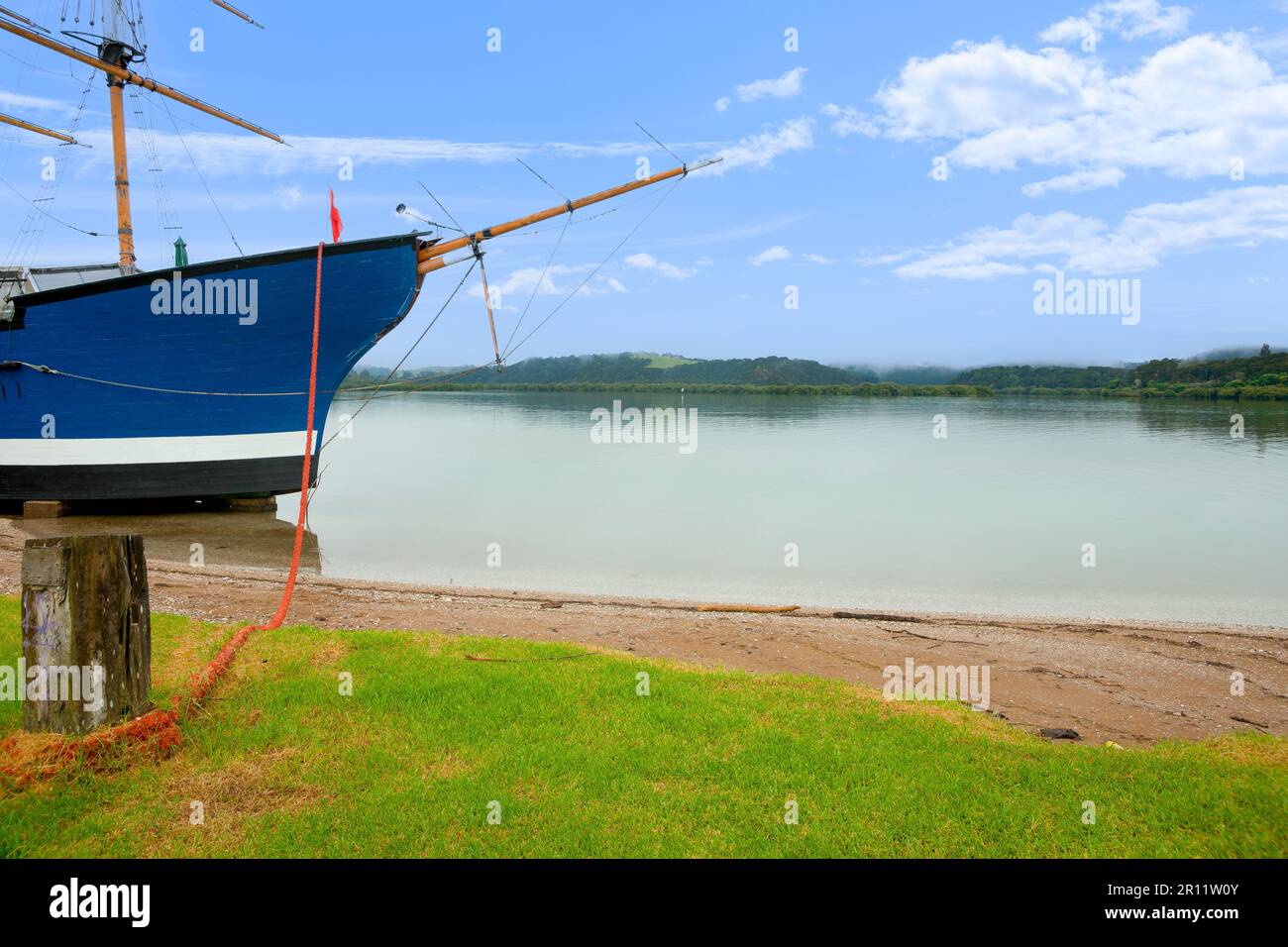 Square rig ship bow framing scene across bay Stock Photo - Alamy