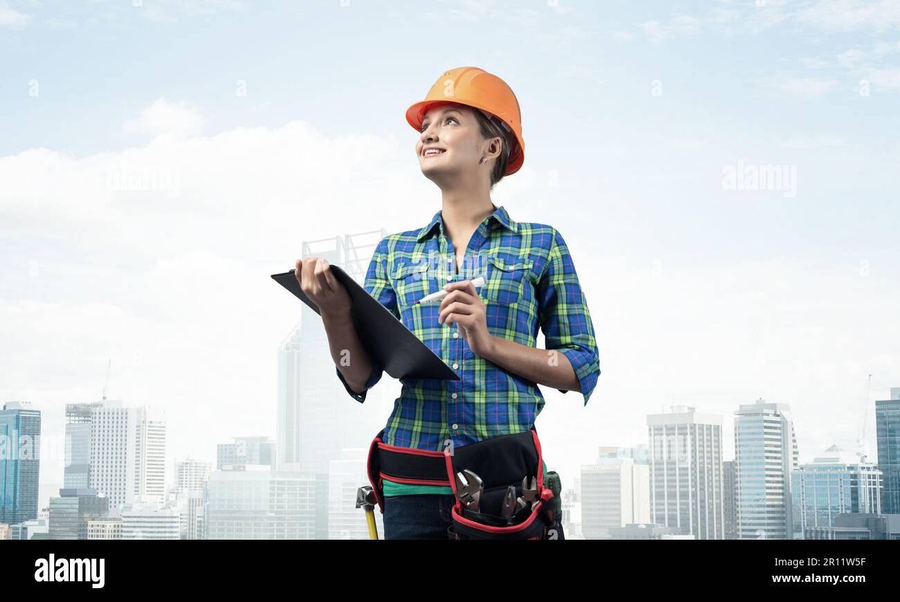 Young building inspector checking outdoor Stock Photo - Alamy
