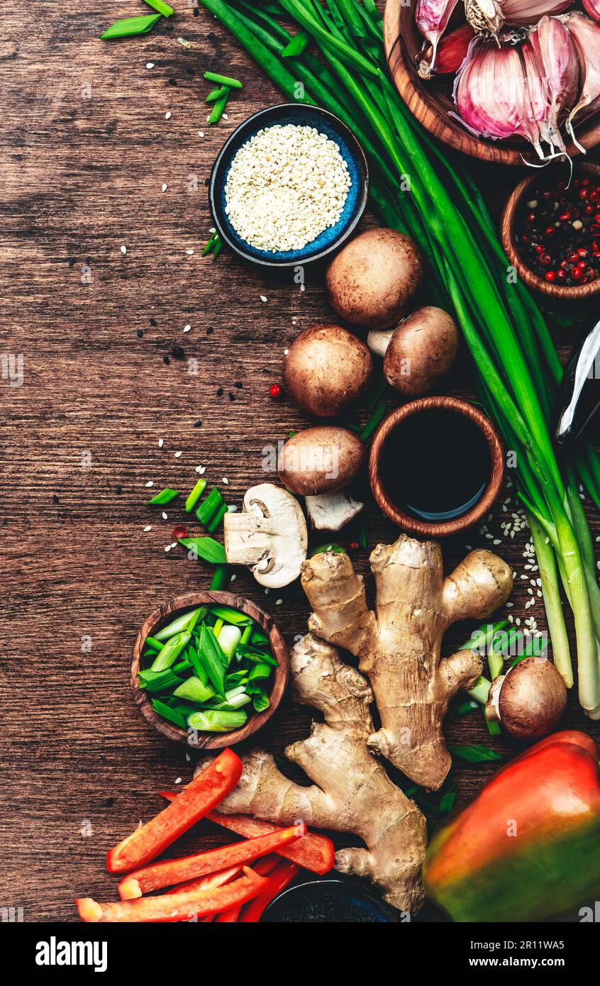 Asian cuisine ingredients with vegetables, food background. Ginger ...