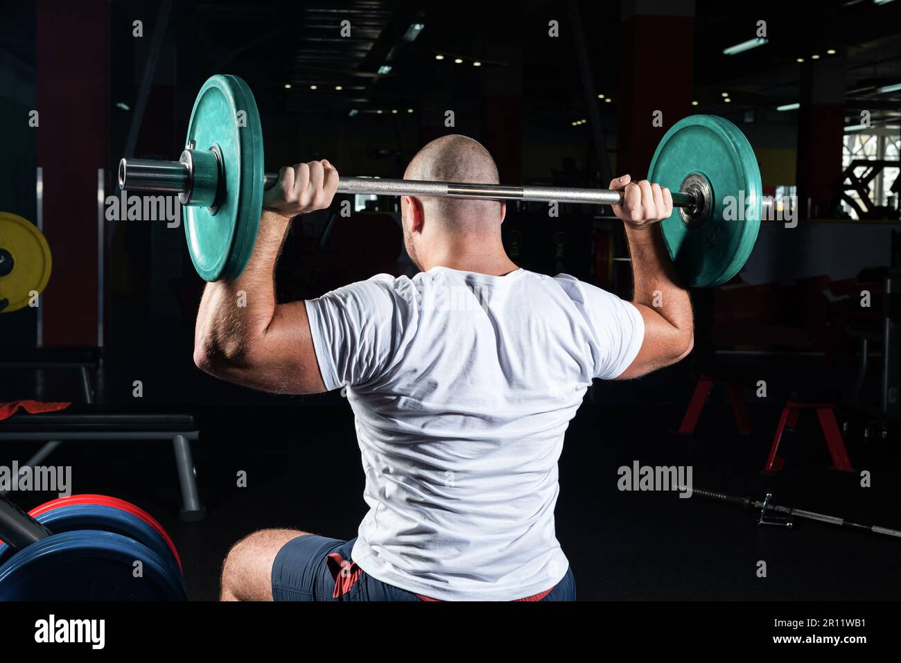 Young athlete lifts heavy barbell hi-res stock photography and images ...
