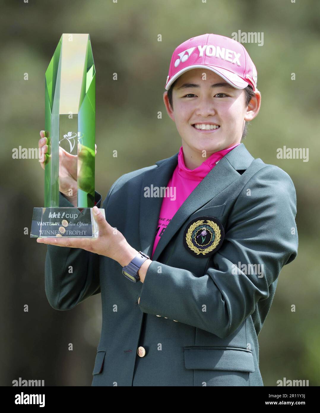 Akie Iwai holds up the trophy after winning the Vantelin Ladies Open ...
