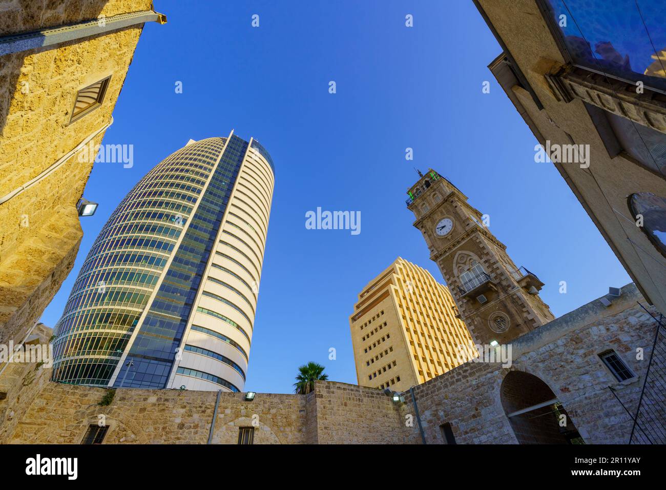 View of the yard, Minaret, and clock tower of the Al Jarina Mosque ...