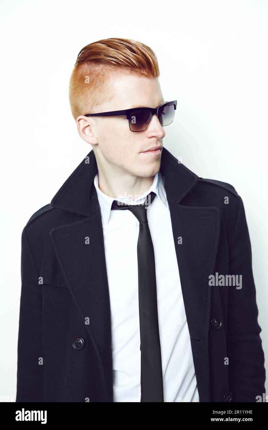 Fashion, cool and man in a suit in a studio with sunglasses and a ...