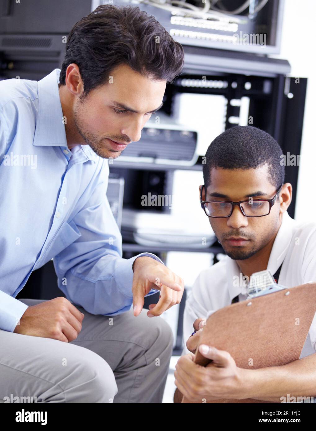 It engineers in network server room hi-res stock photography and images ...
