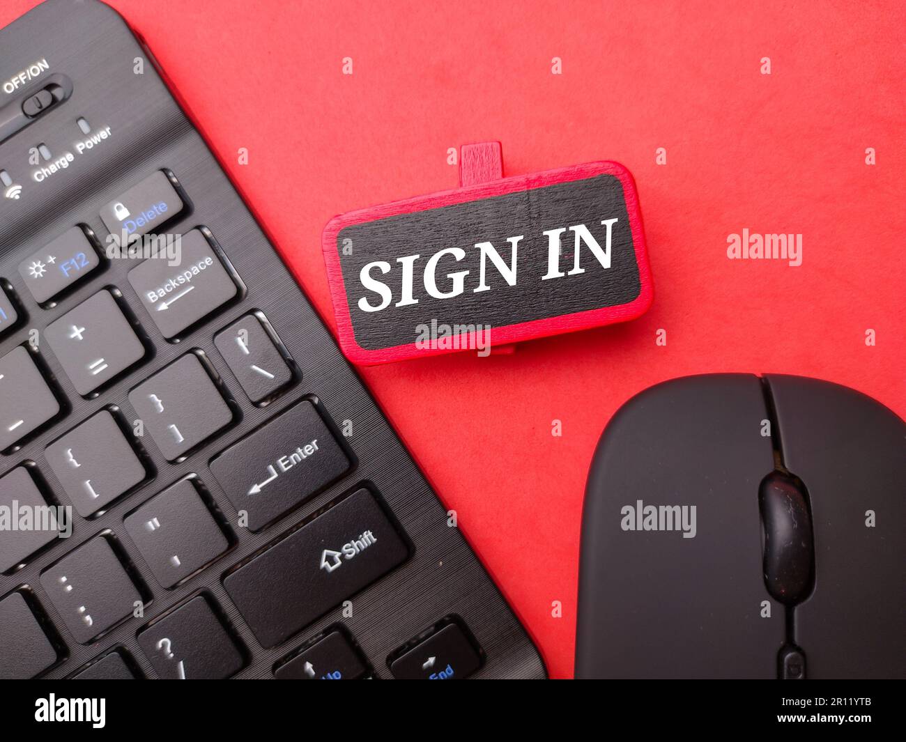 Wireless keyboard and mouse with the word SIGN IN on black background ...