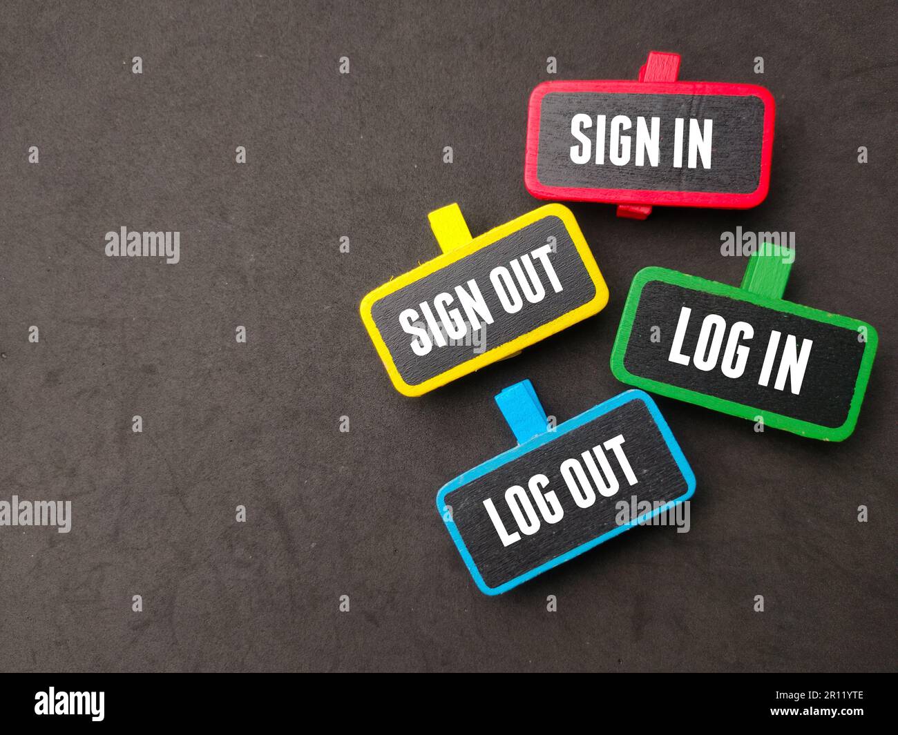 Colored wooden board with the word Sign in Sign out Log in Log out on ...