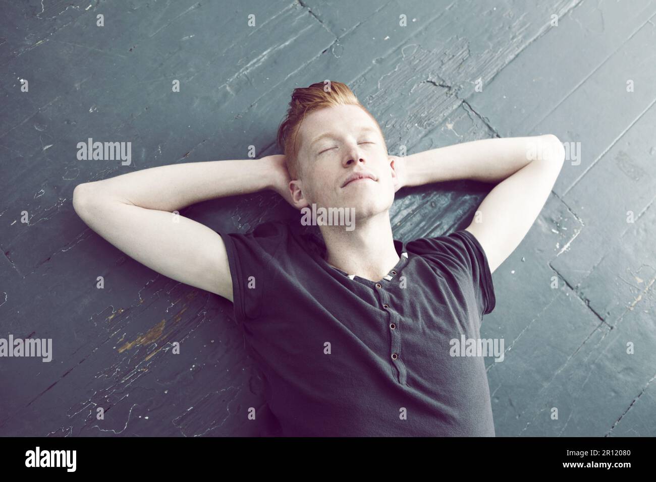 Man lying on ground hands hi-res stock photography and images - Alamy