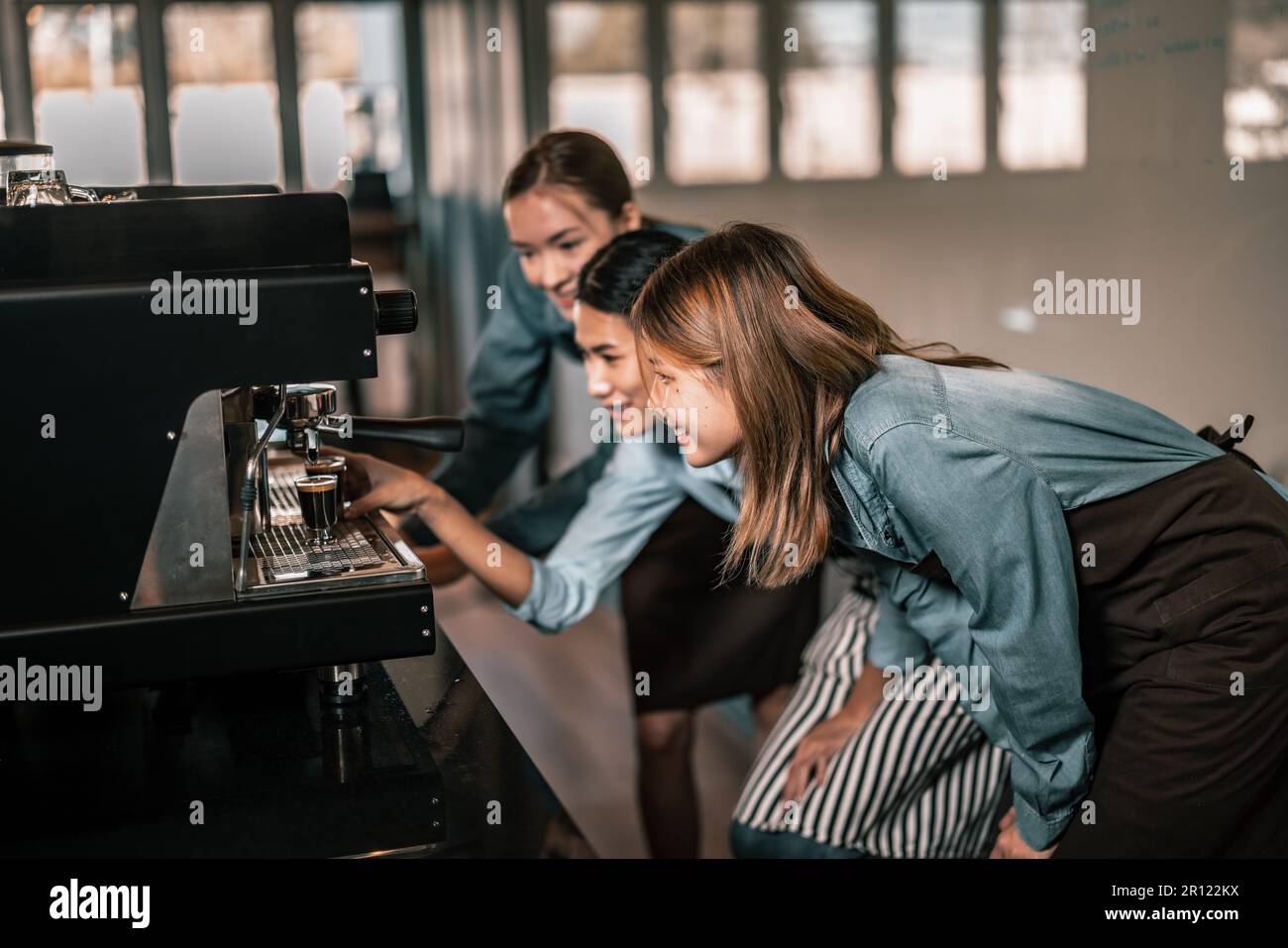 Young adult coffee makers work with skilled baristas to create menus ...
