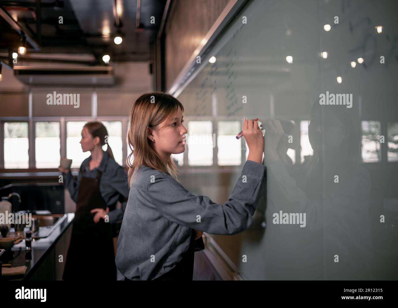 Young adult coffee makers work with skilled baristas to create menus ...