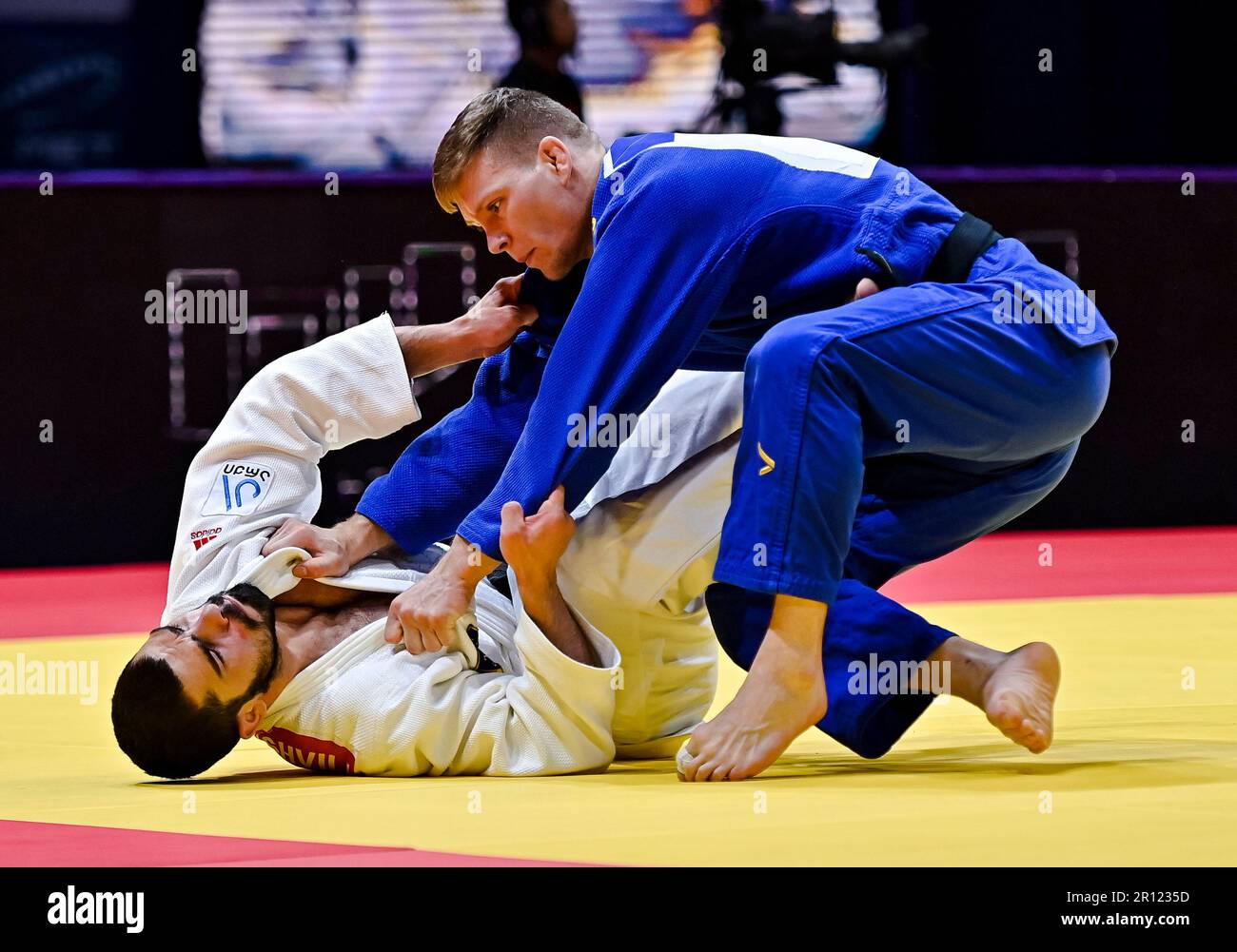 Doha. 10th May, 2023. Tato Grigalashvili (bottom) of Georgia and Matthias Casse of Belgium ...