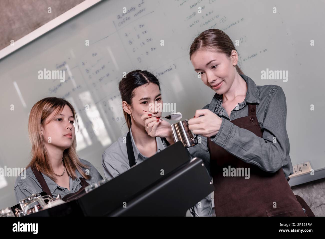 Young adult coffee makers work with skilled baristas to create menus ...