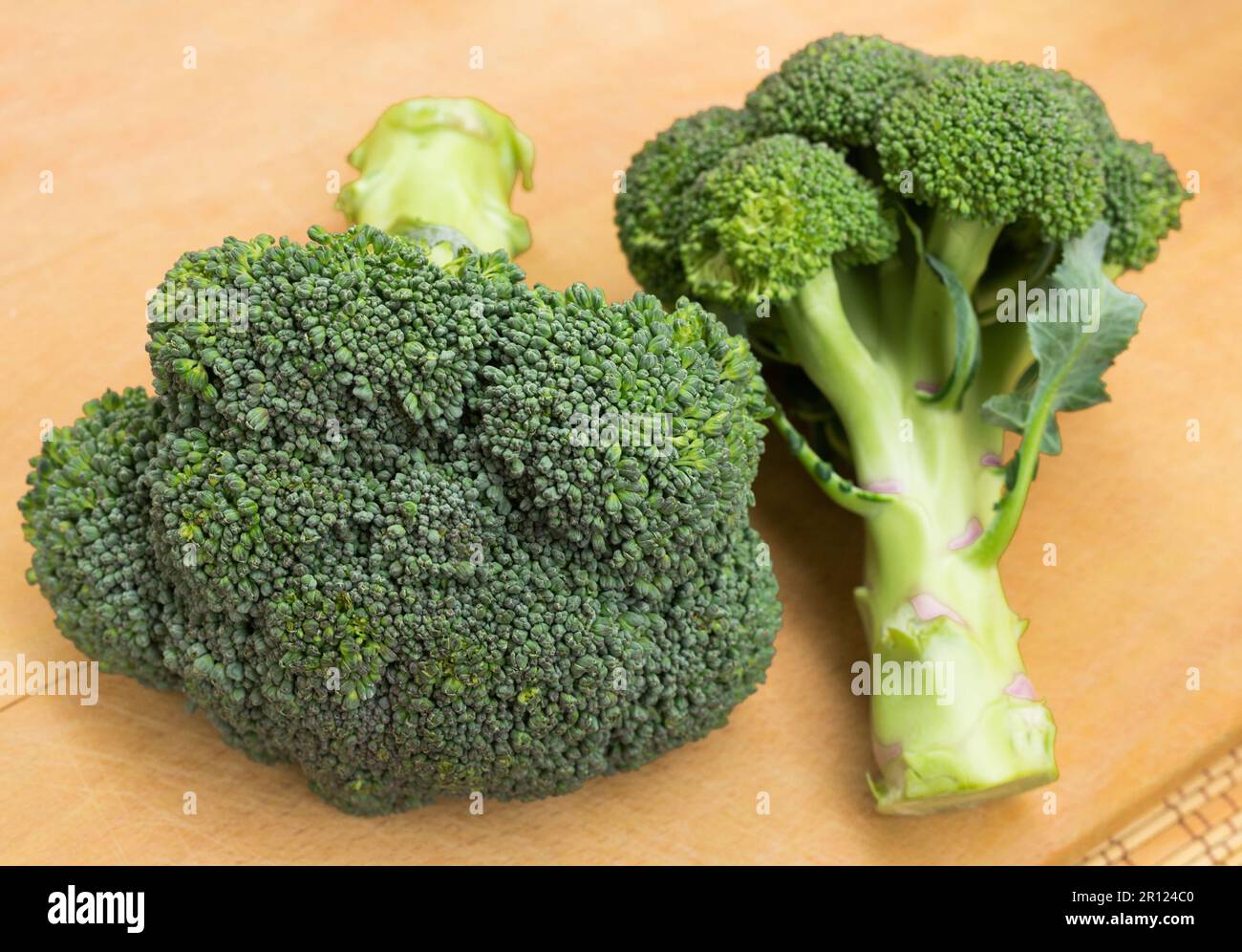 healthy broccoli and florets on wooden board Stock Photo - Alamy