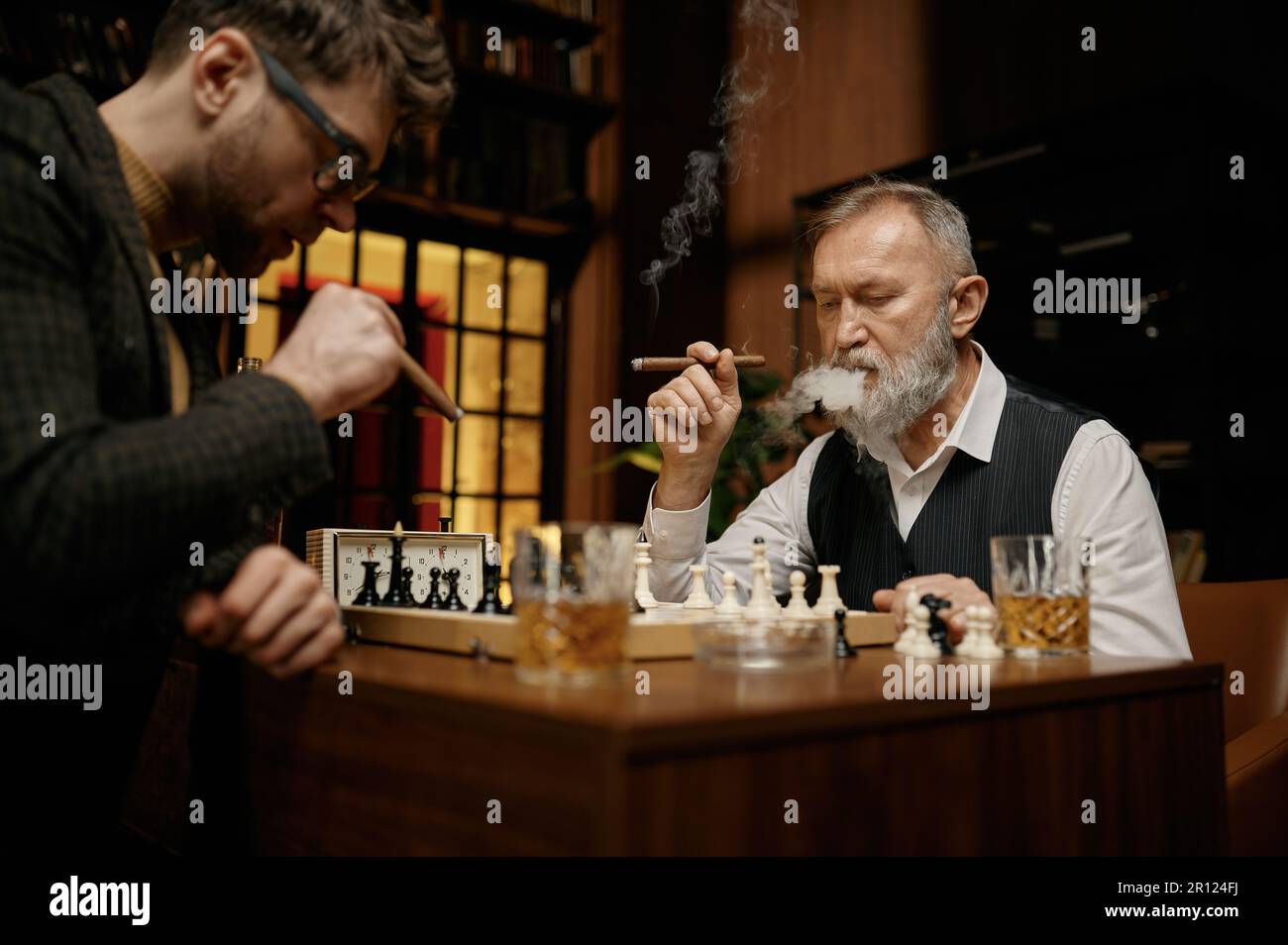 Man smoking while playing chess hi-res stock photography and images - Alamy