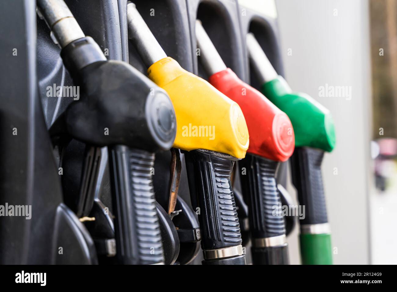 gas station. Pistols with gasoline and diesel fuel at a car gas station ...