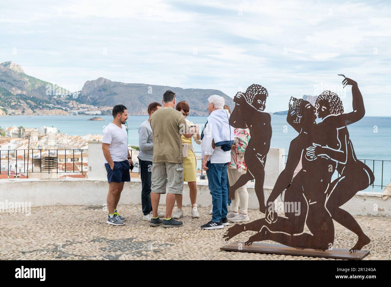 A group of people standing at Mirador del Portal Viejo viewpoint in the ...