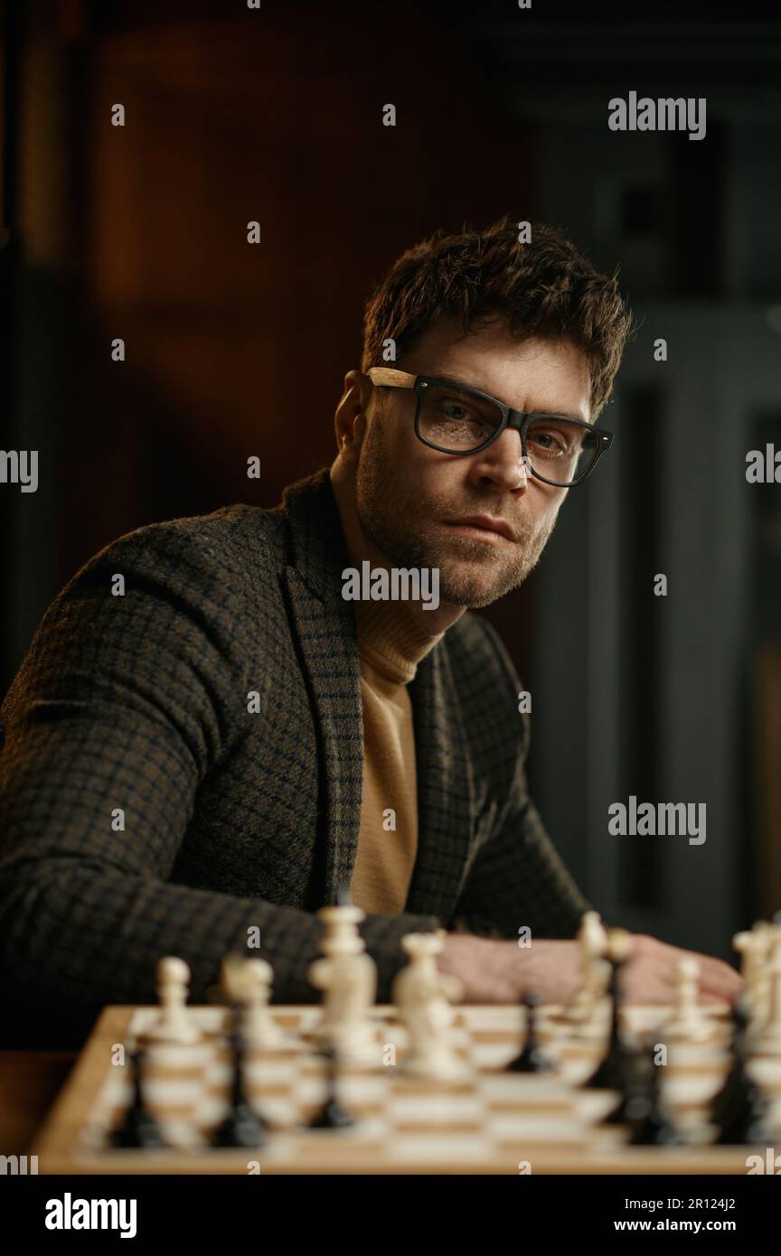 Portrait of man chess player with chessboard Stock Photo - Alamy