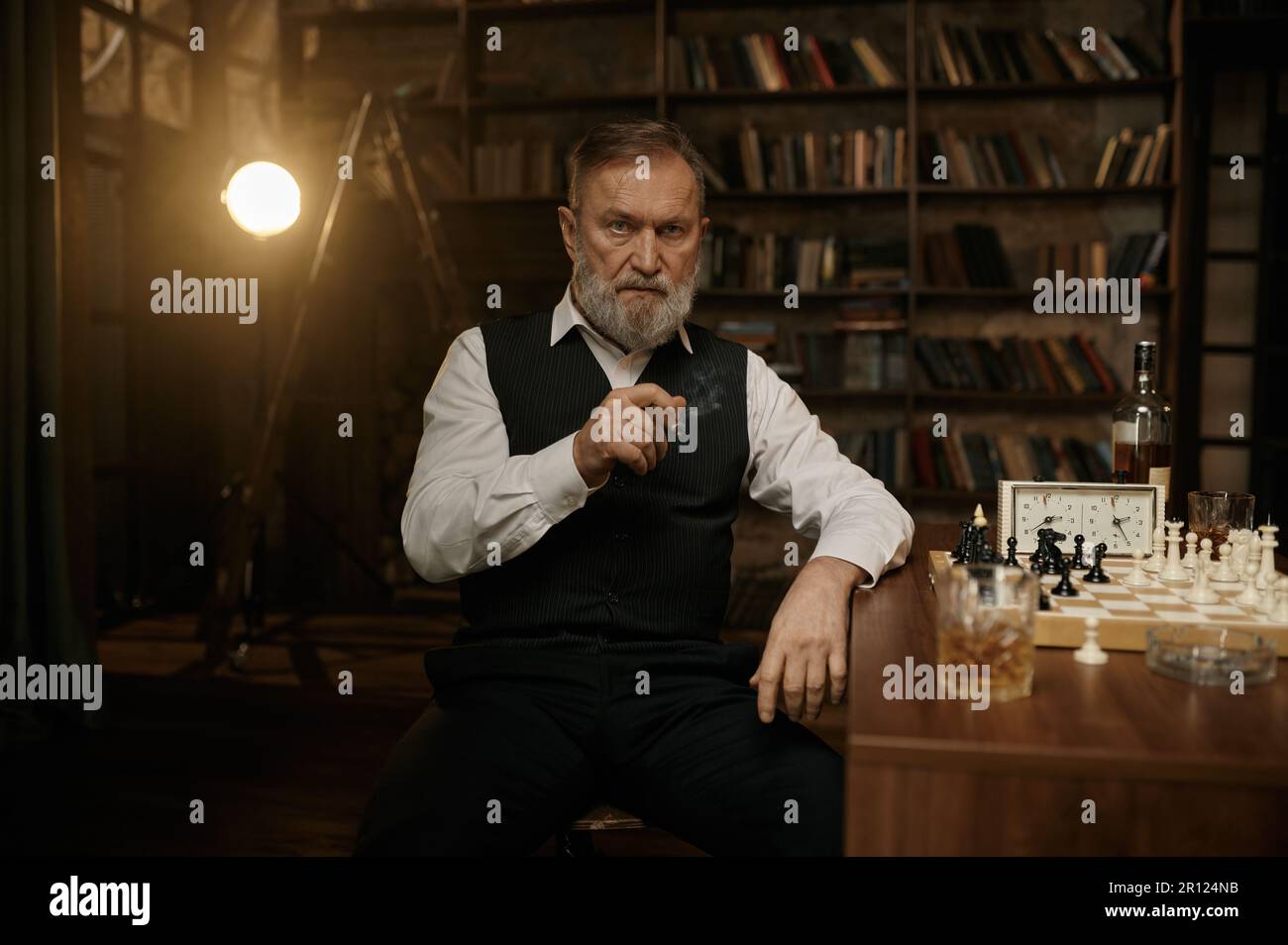 A chess player smoking cigar and planning strategy of game Stock Photo ...