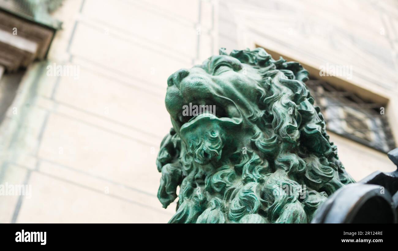 A detailed sculpture of a Bavarian lion perched atop a building, Munich ...