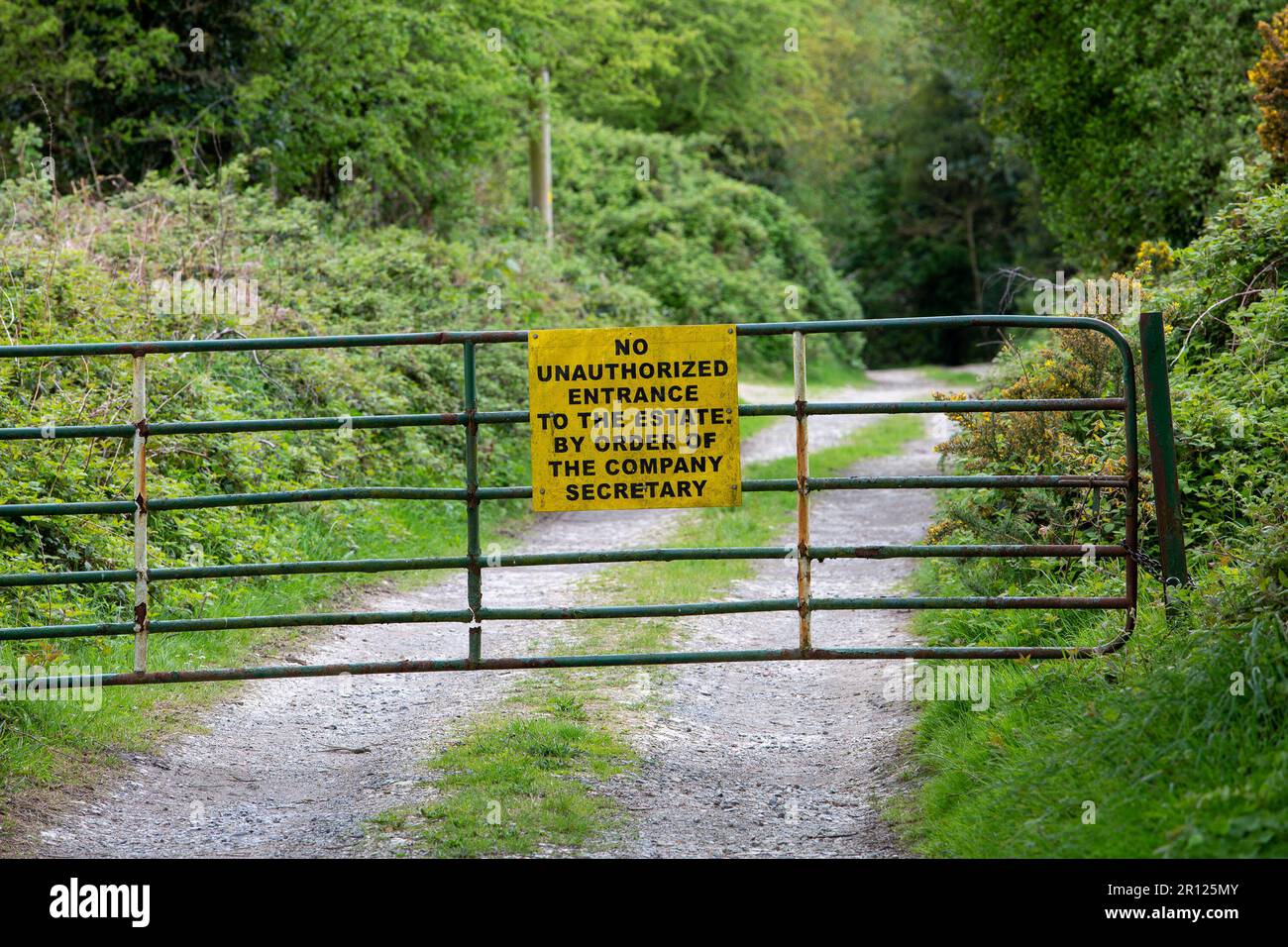 No unauthorized entrance sign on metal gate on country lane Stock Photo ...