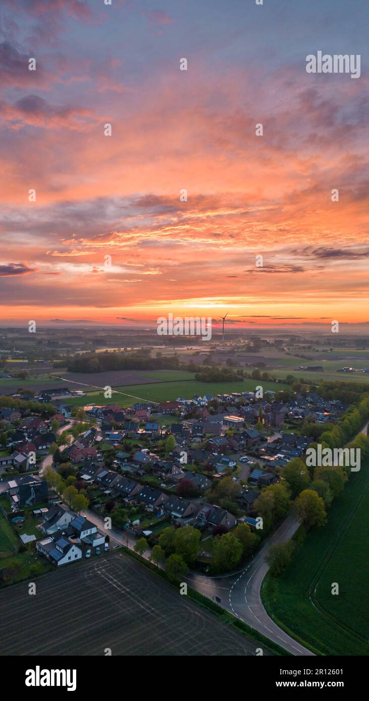 An aerial view of a city skyline at sunset over a rural suburb Stock ...