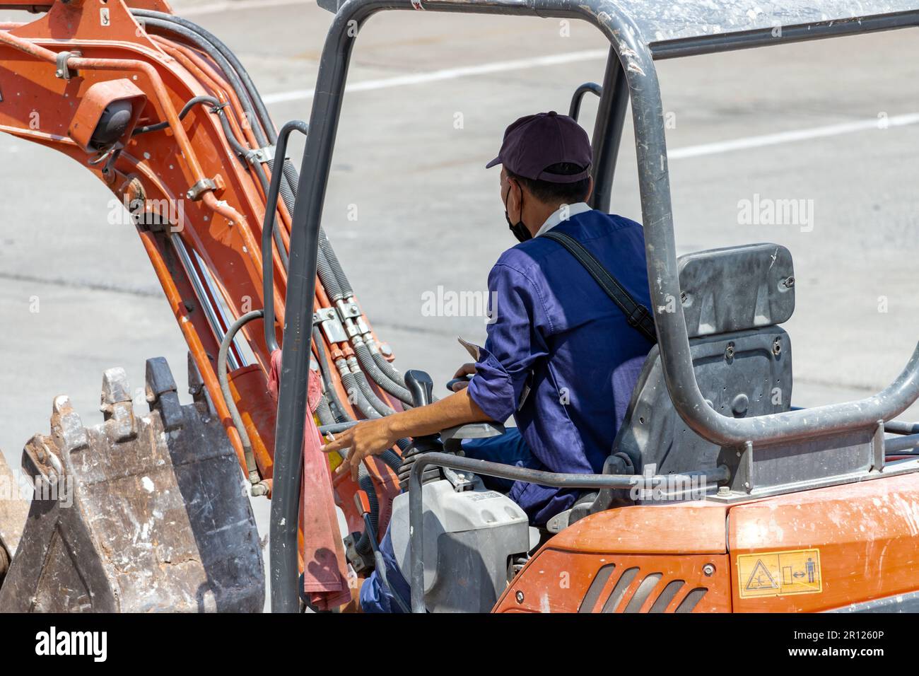 Backhoe city street hi-res stock photography and images - Alamy