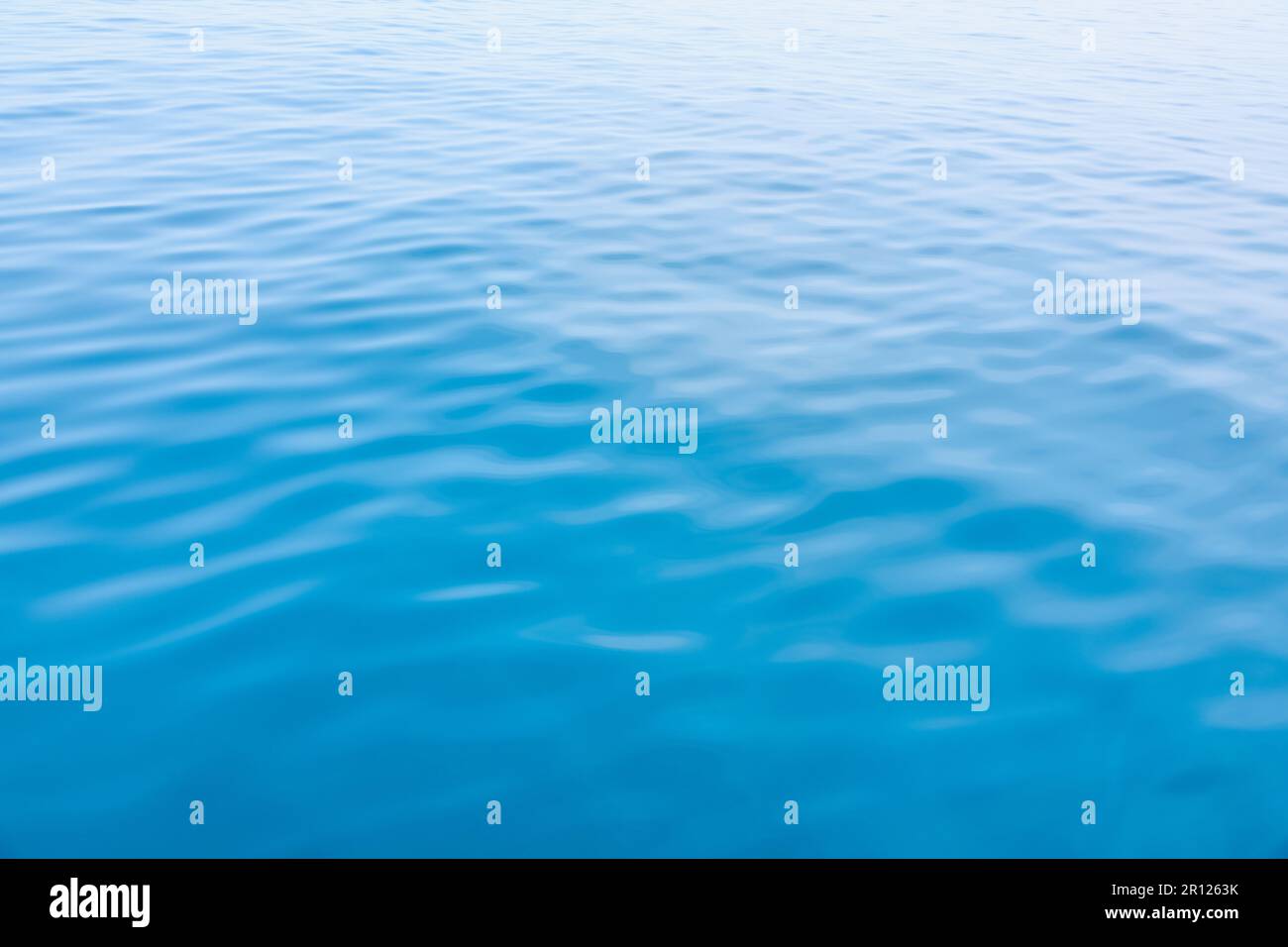 Blue sea with gentle waves and a sky, a peaceful ocean with small waves ...