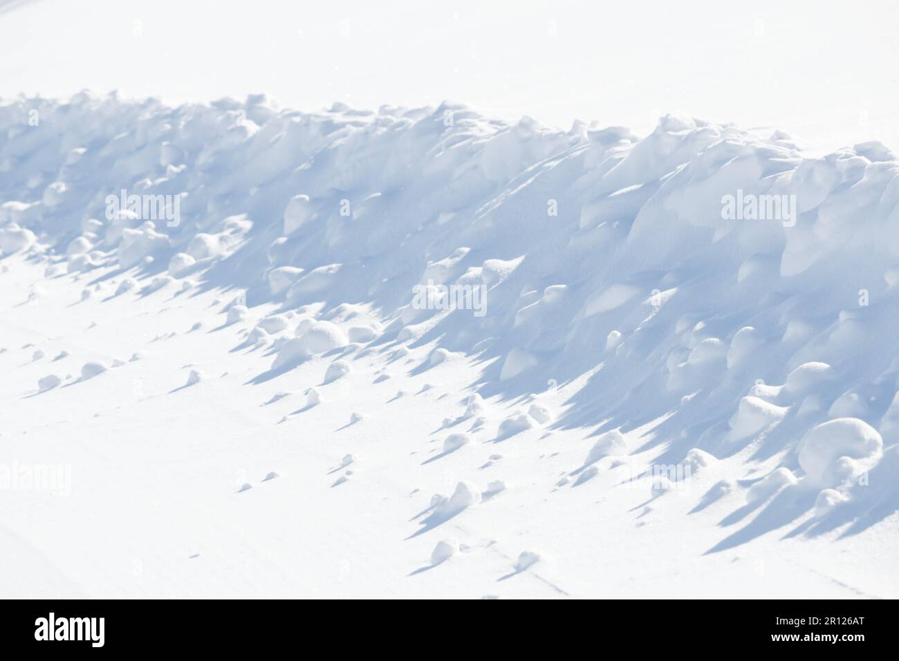 Curved edge of groomed ski slope Stock Photo - Alamy
