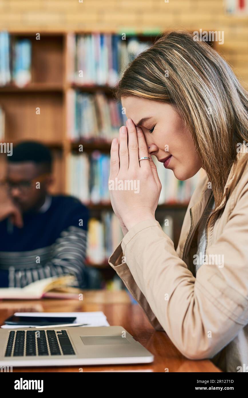 Please dont let me fail this test...a young woman looking stressed ...