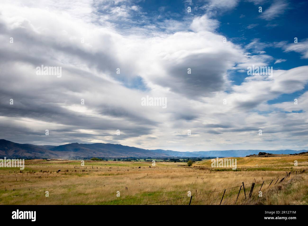 Cloud formations over grasslands, near Omakau, Central Otago, South ...