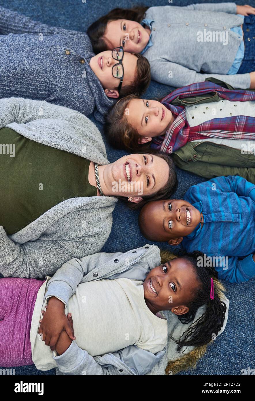 Shes their favourite teacher. Portrait of a group of elementary school ...