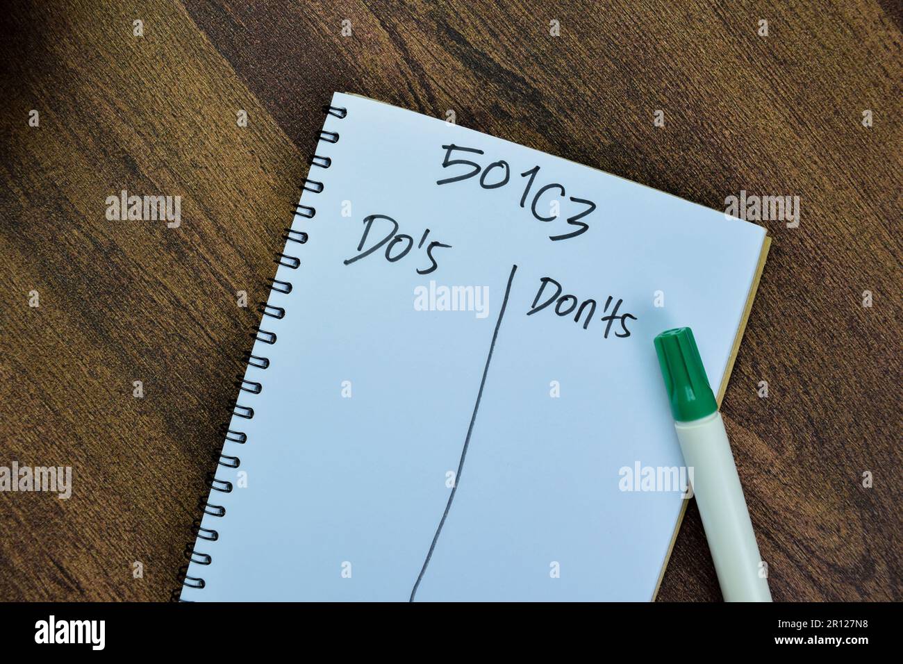 Concept of 501C3 Do's and Don'ts write on book isolated on Wooden Table ...