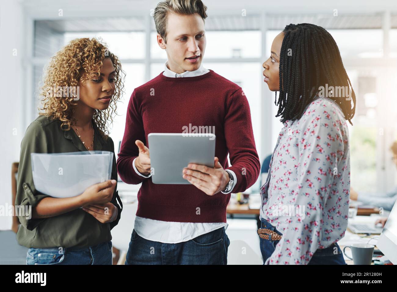 Teamwork makes the job so much simpler. a group of colleagues using a ...