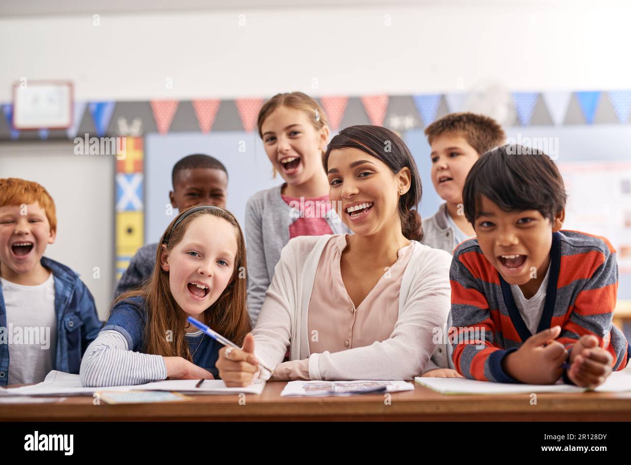 They love their teacher. elementary school children in class Stock ...