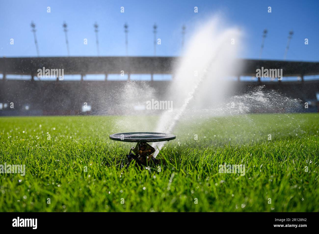 Watering grass on a football stadium Stock Photo - Alamy