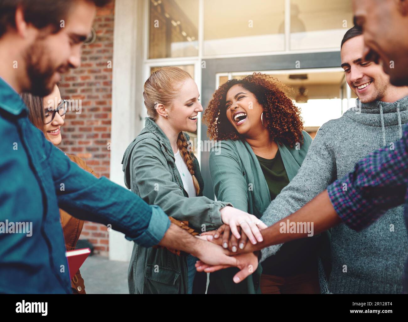 Whats college without good friends. a group of young students joining ...