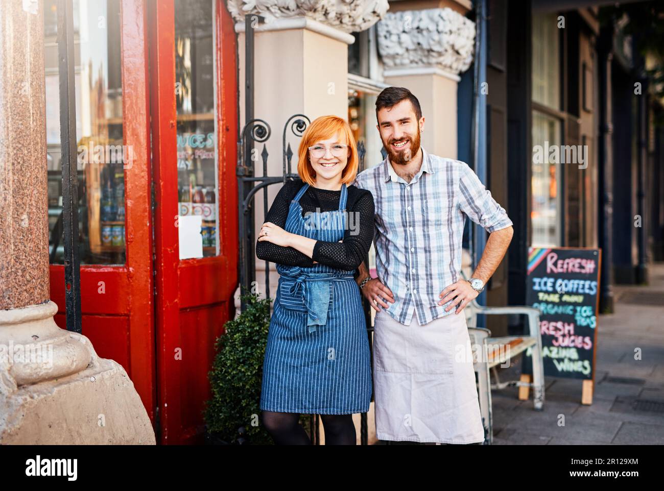 Our cafe is the best in town. co-owners standing outside their coffee ...