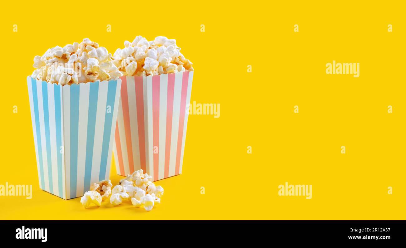 Two pink and blue white striped carton buckets with tasty cheese ...