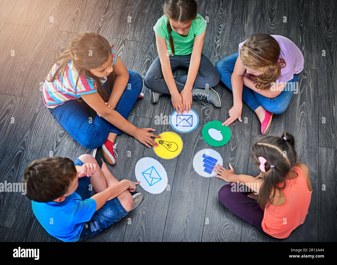 Learn and play everyday. High angle shot of a group of kids playing a ...
