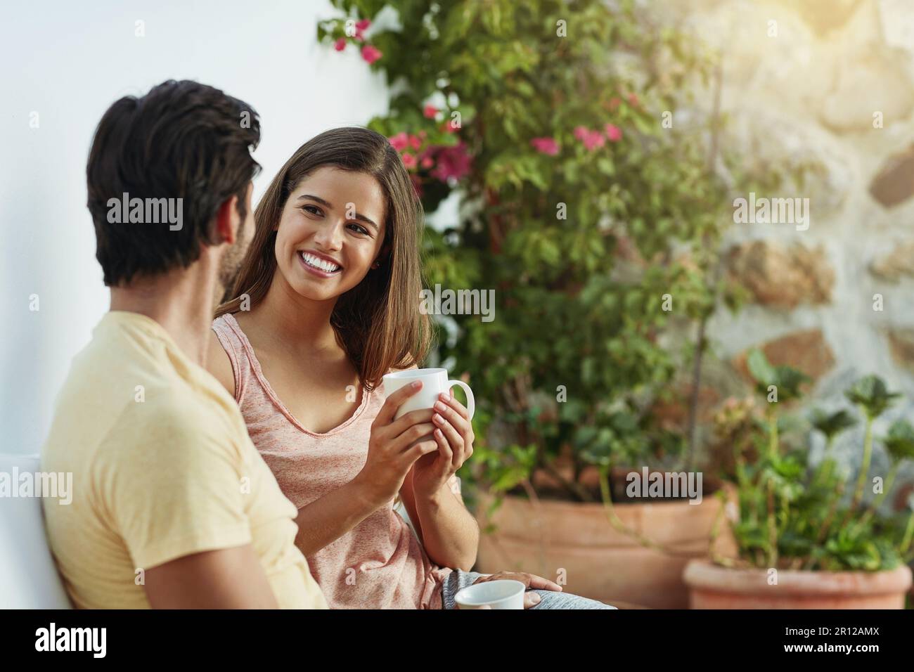 Taking a coffee break together. a happy young couple having coffee ...
