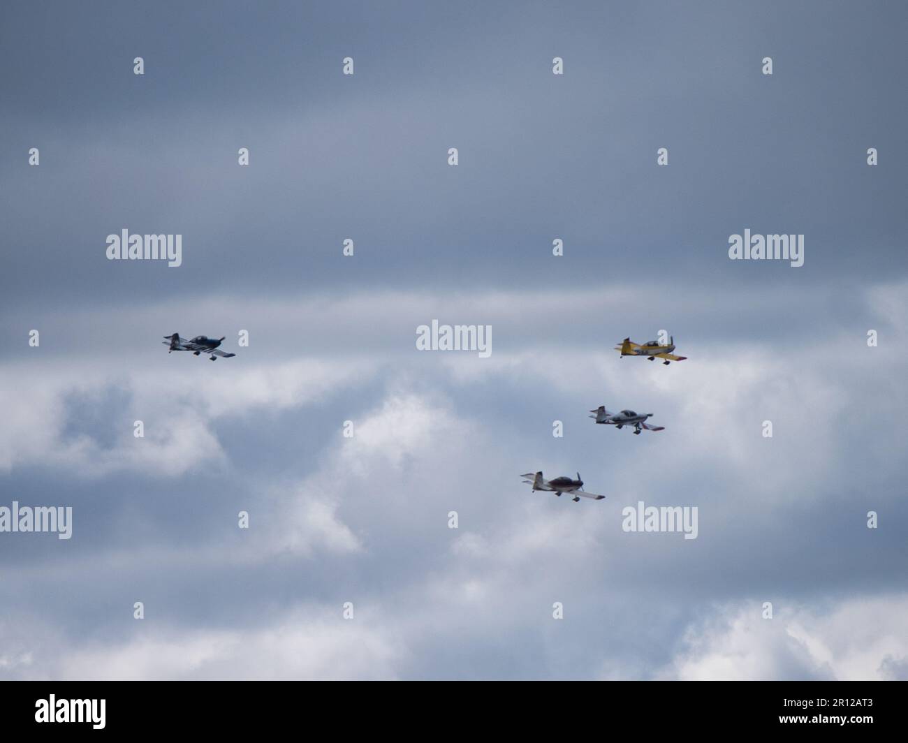 Four airplanes flying together in an air show Stock Photo - Alamy