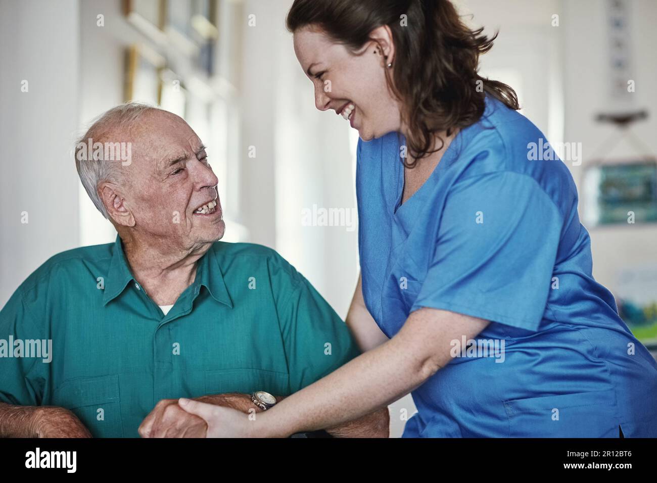 Compassion is at the heart of our care. a female nurse standing next to ...