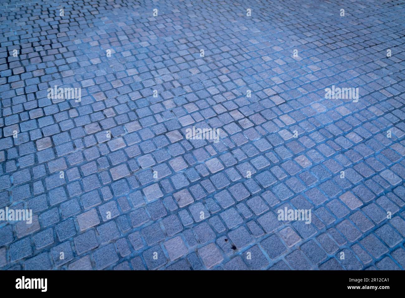 Cobblestone pavement texture background Stock Photo - Alamy