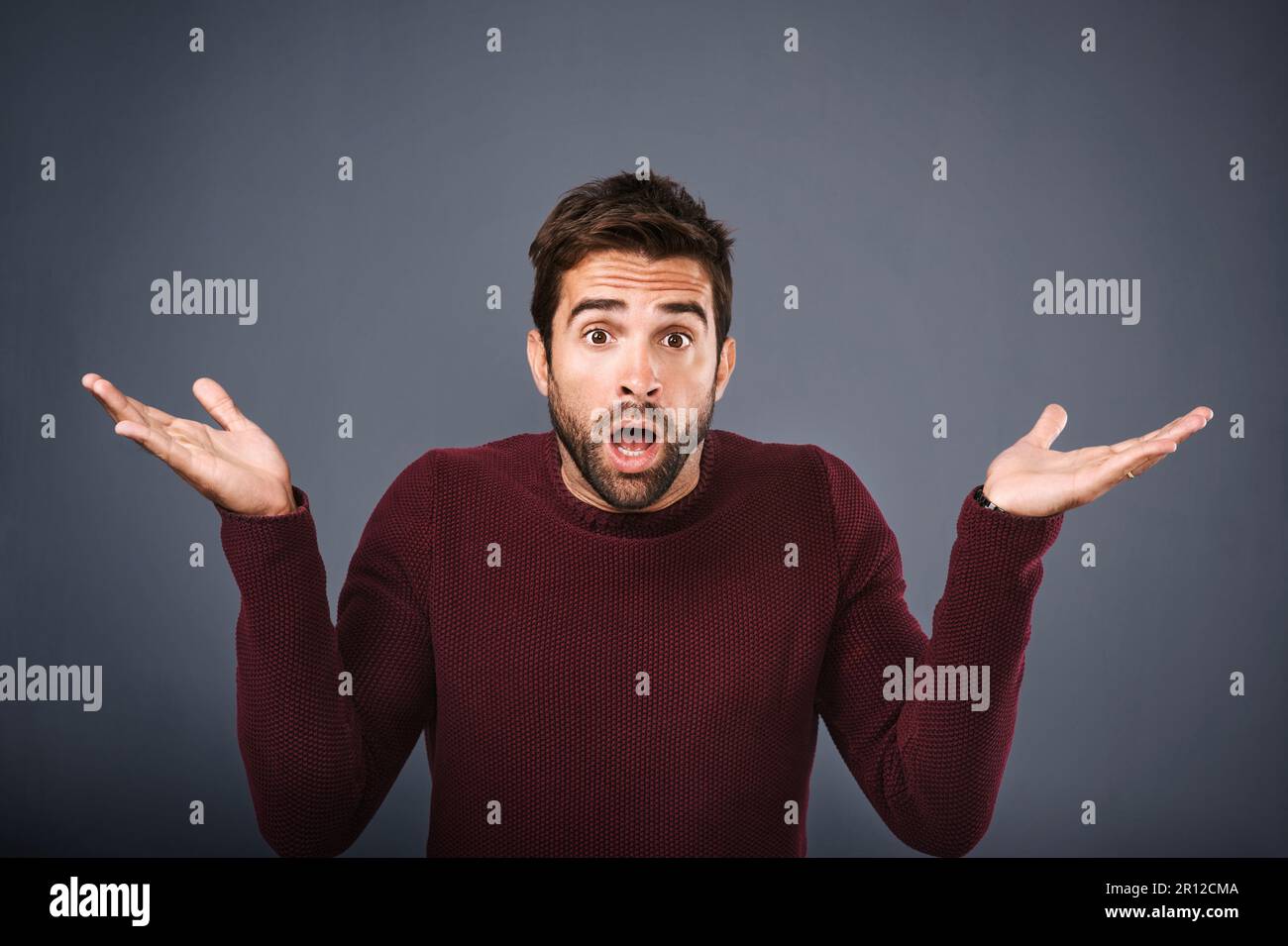 What does that even mean. Studio shot of a handsome young man looking ...