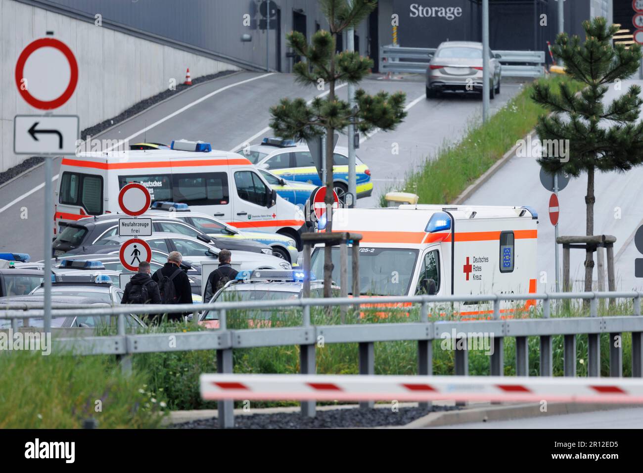 Police emergency vehicles are parked at a Mercedes-Benz plant in ...