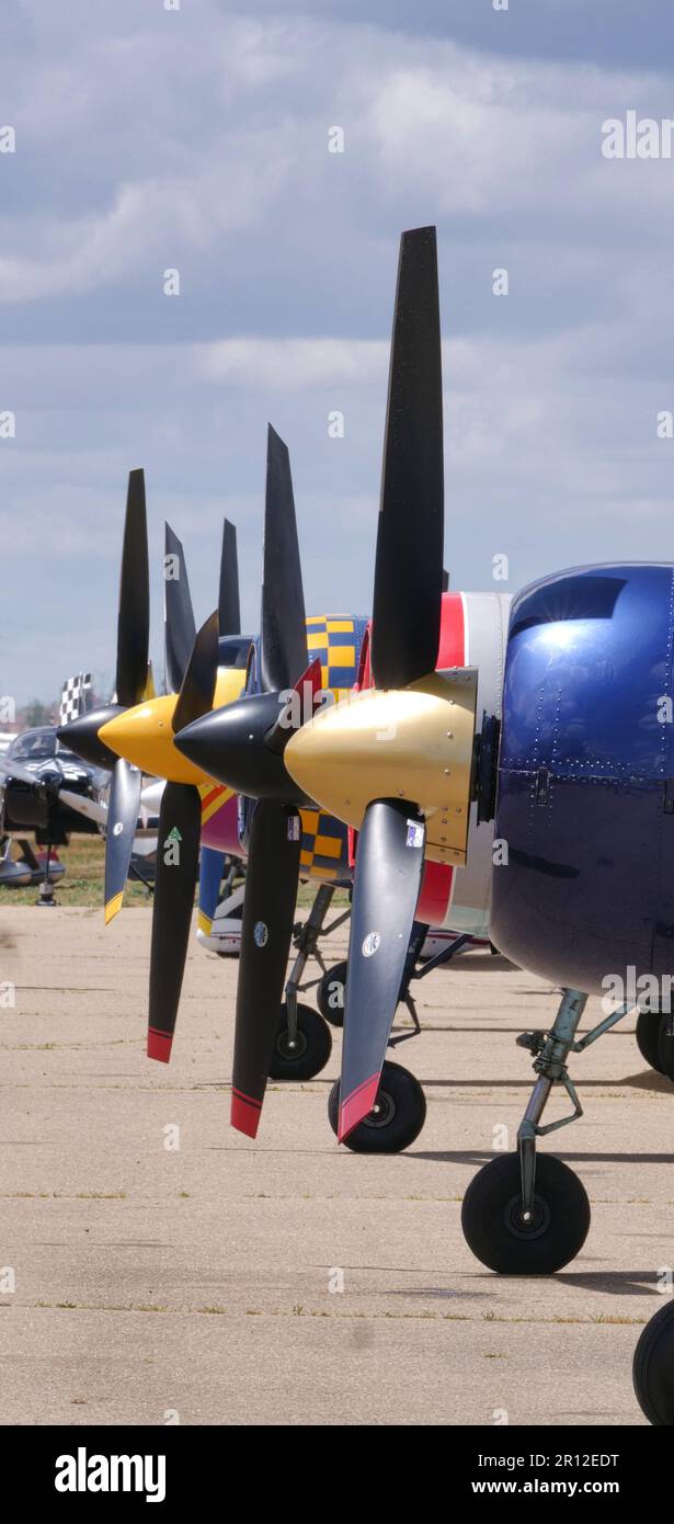 A close up image of a parked airplane's front propeller, showing the ...