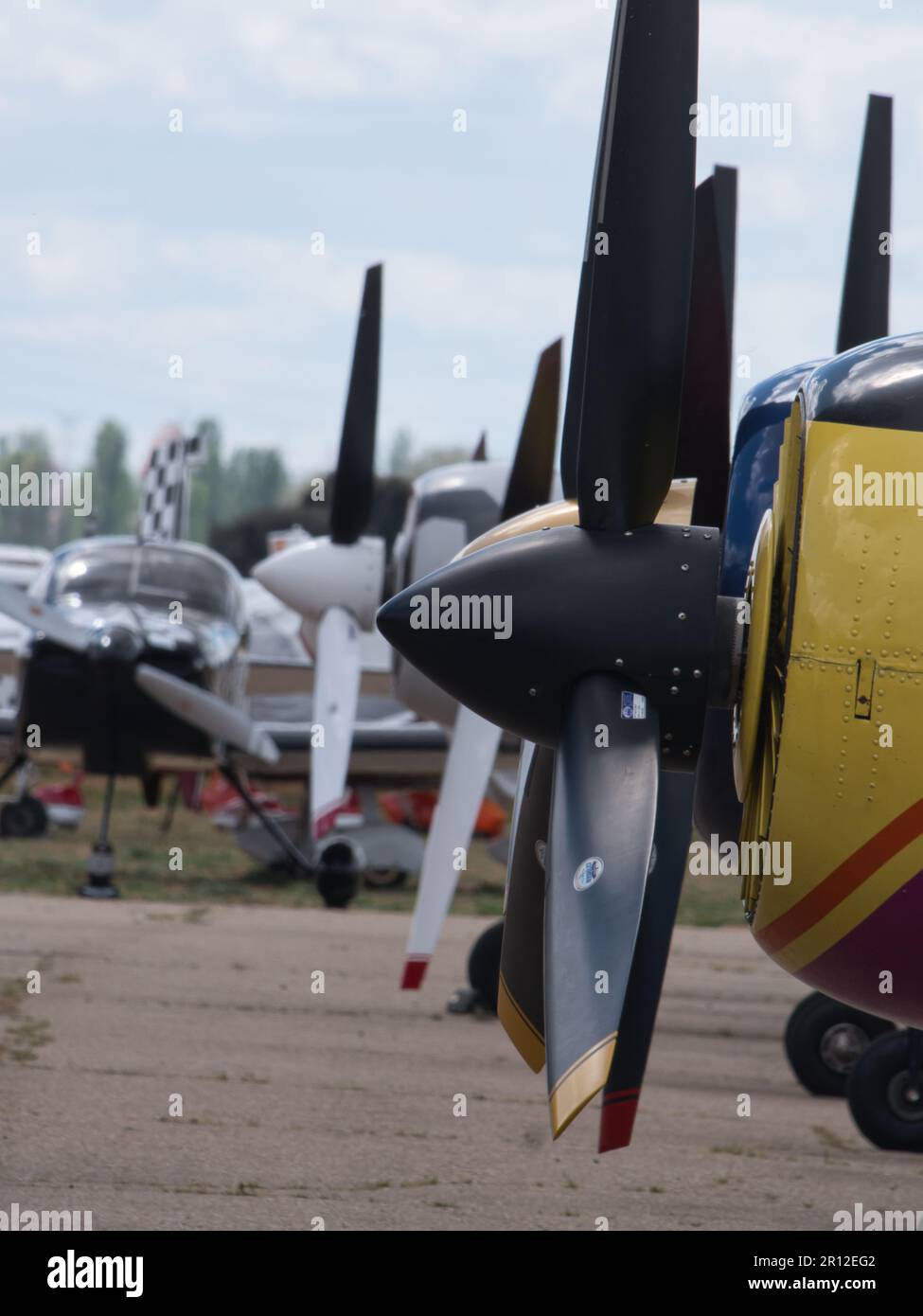 A close up image of a parked airplane's front propeller, showing the ...