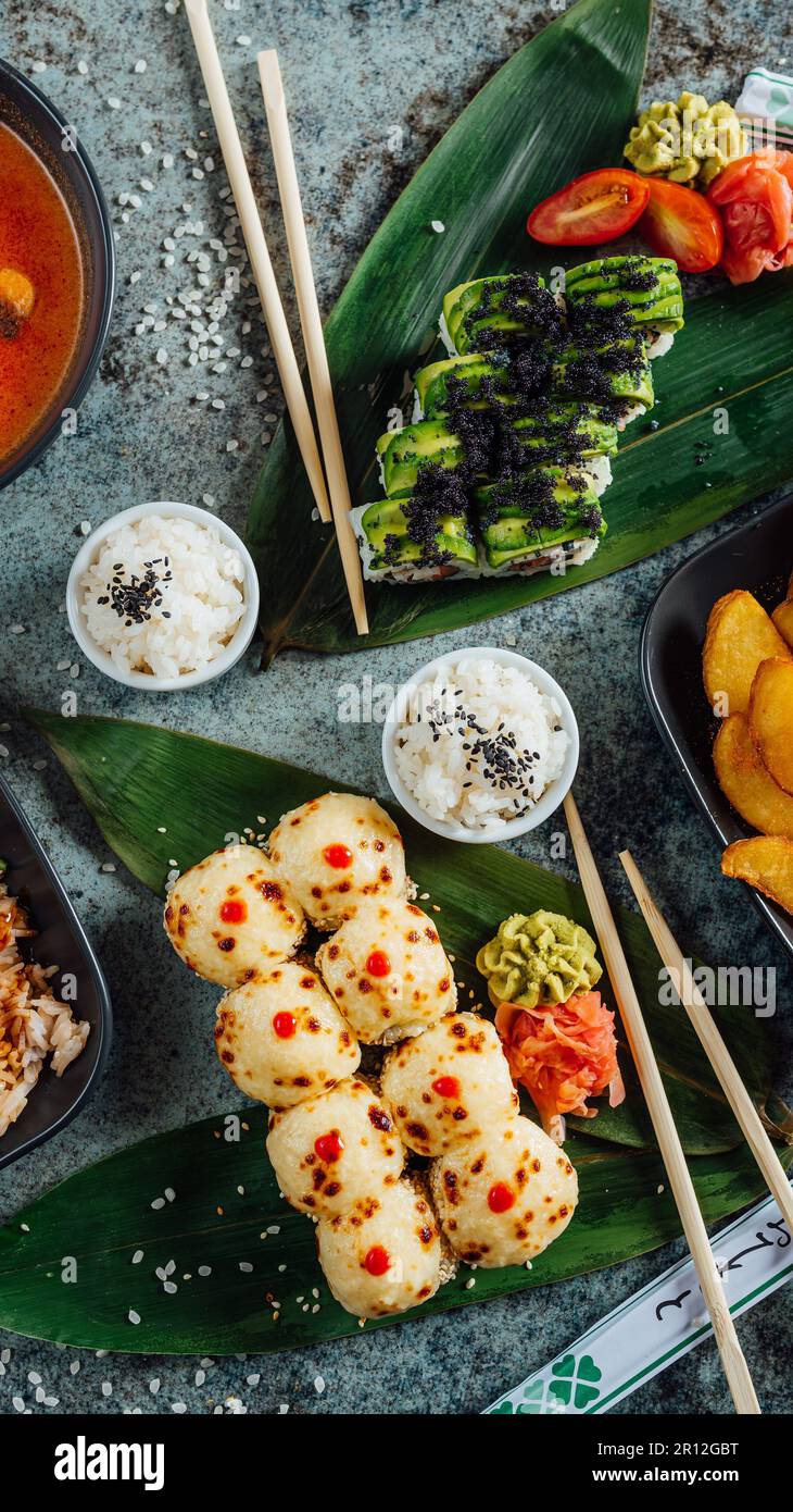 A variety of Asian and Thai dishes in metal trays, arranged in an ...