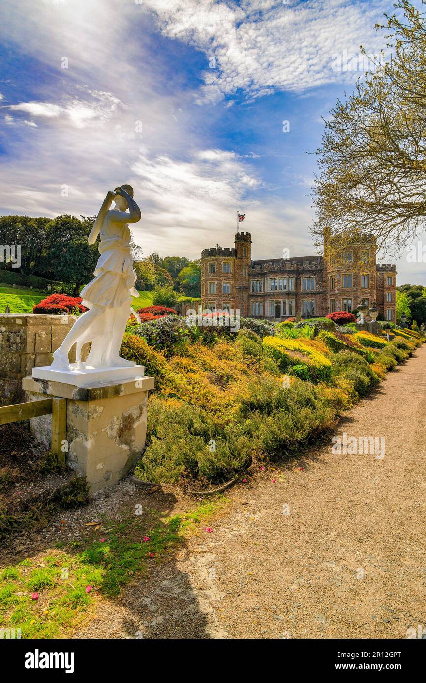 An impressive statue in the colourful formal garden next to the rebuilt ...