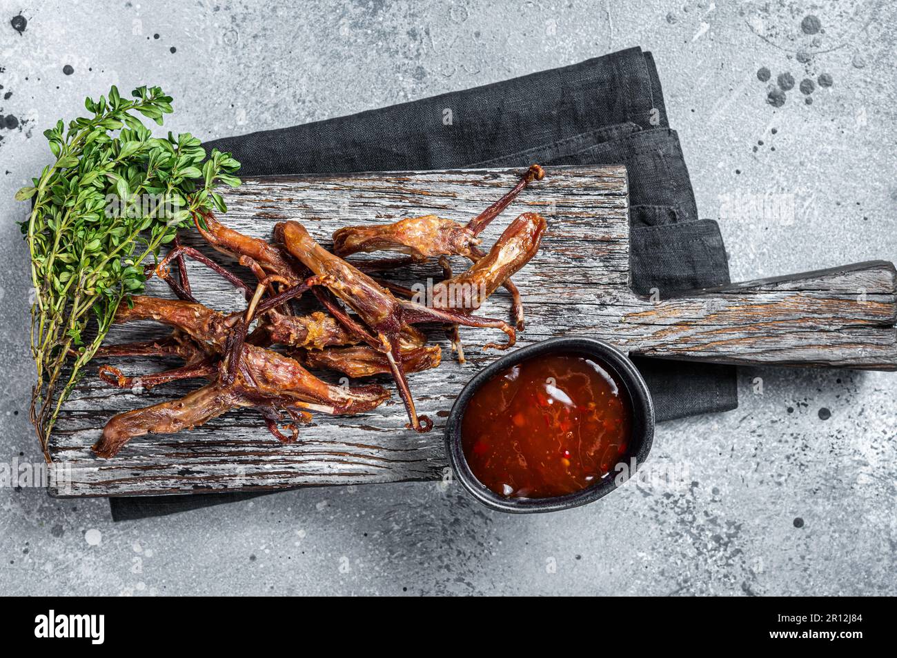 Chinese cuisine Spicy Dip fried duck tongue. Gray background. Top view ...