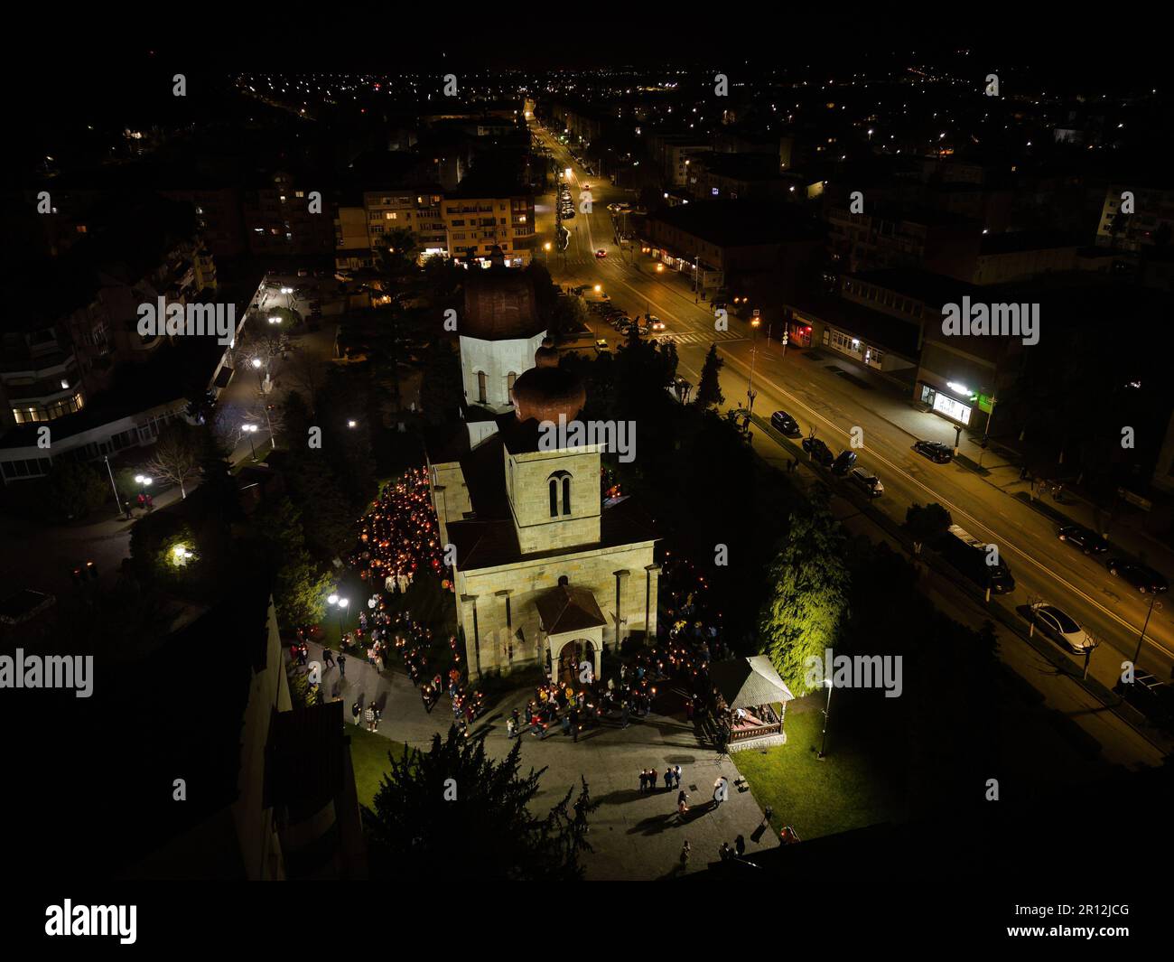 An aerial view of a church with people gathered in the yard Stock Photo ...